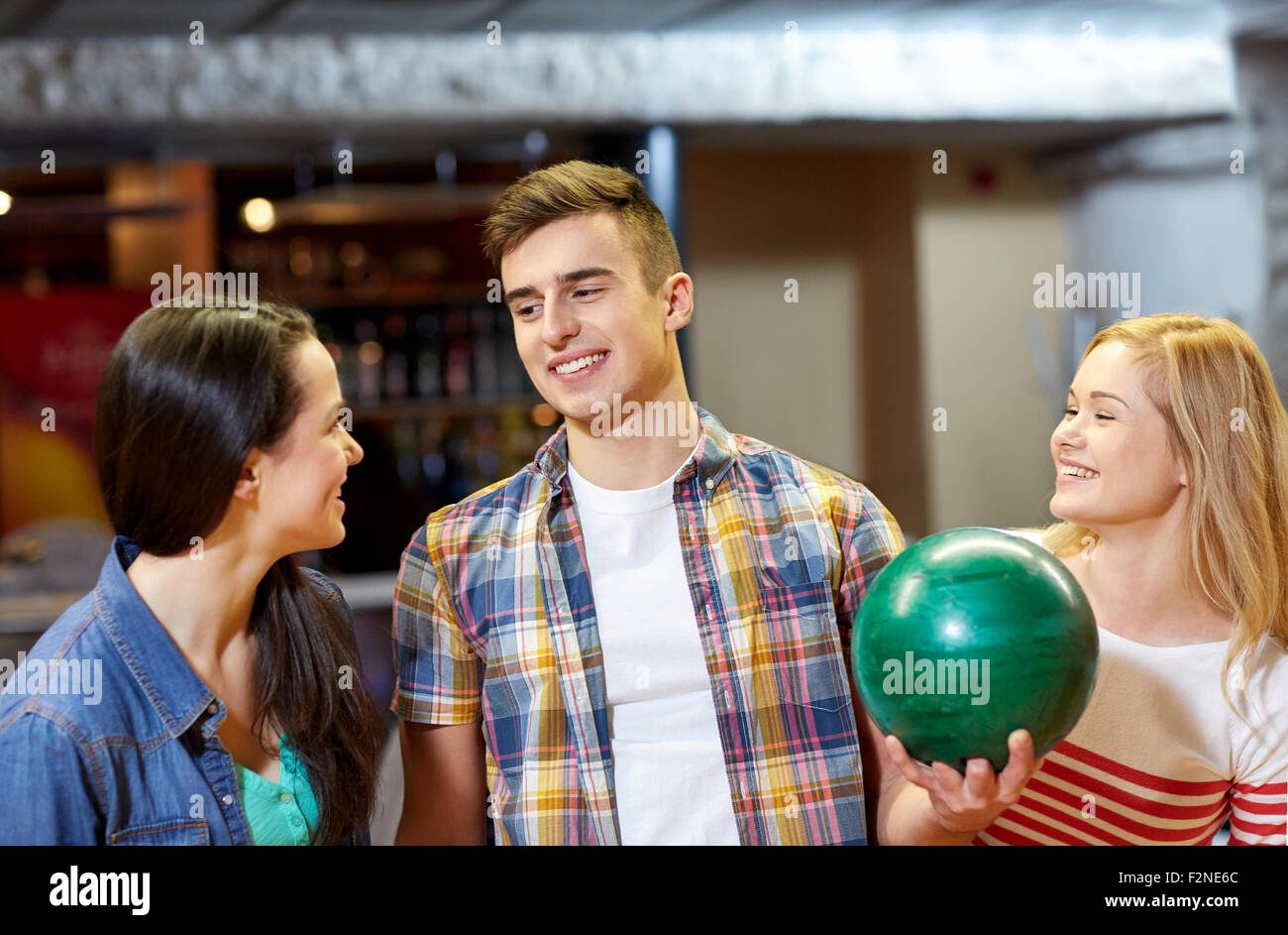 happy friends in bowling club Stock Photo - Alamy