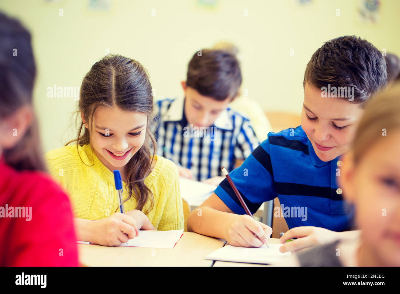 group of school kids writing test in classroom Stock Photo - Alamy