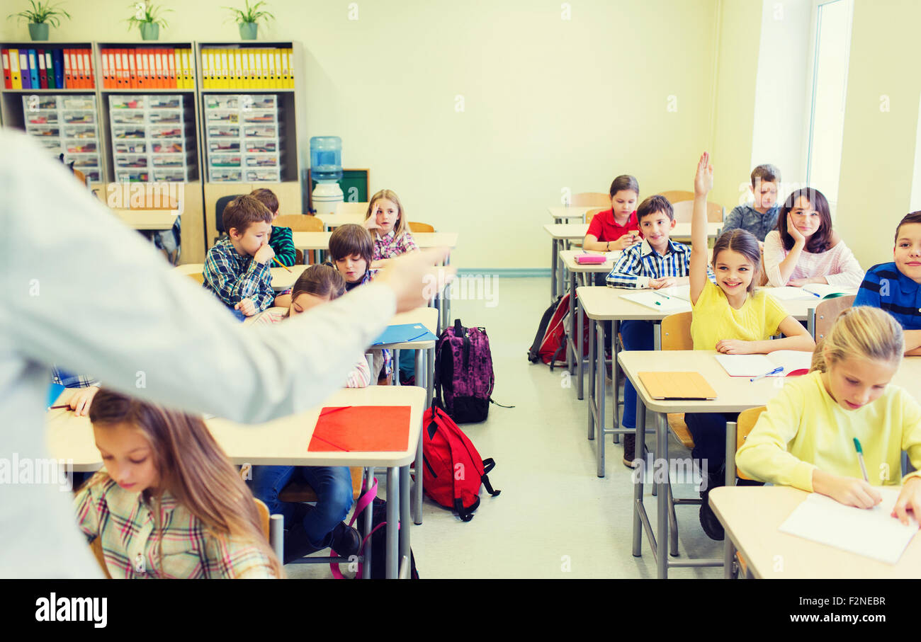 Kids raising hands classroom hi-res stock photography and images - Alamy
