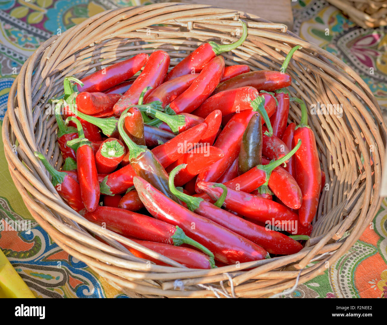 Red hot peppers in a basket Stock Photo - Alamy