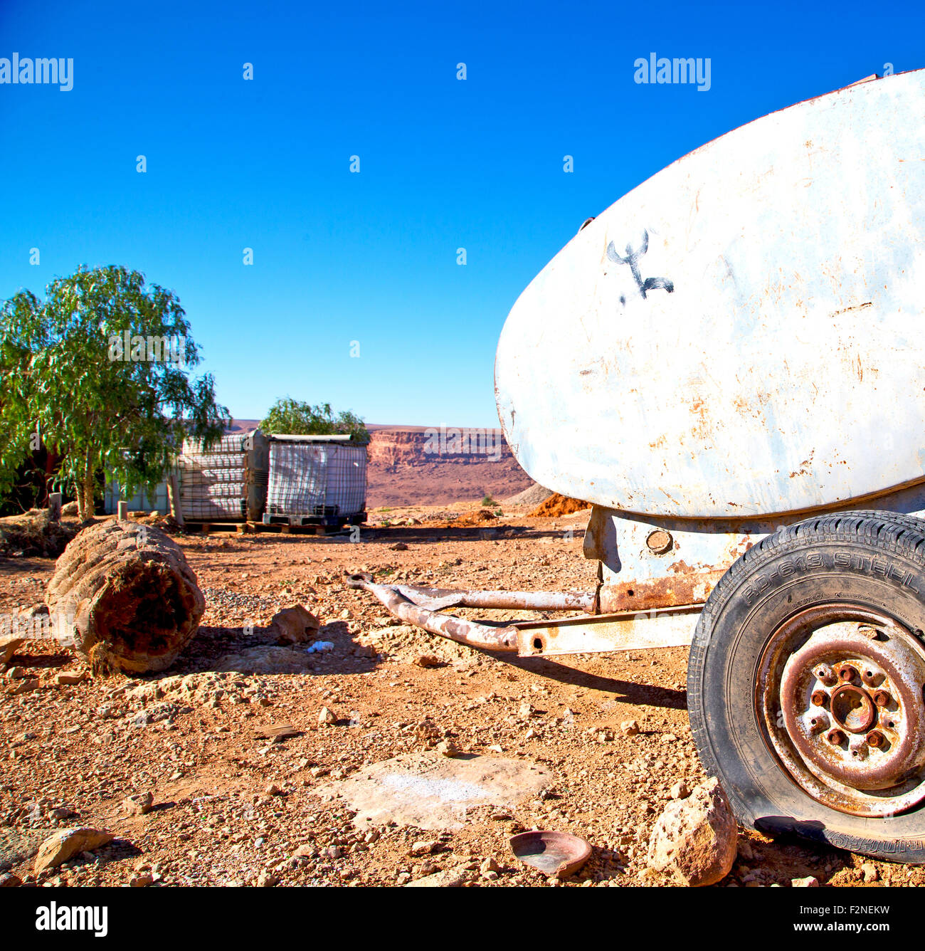 water tank in morocco africa land gray metal weel and arid Stock Photo ...