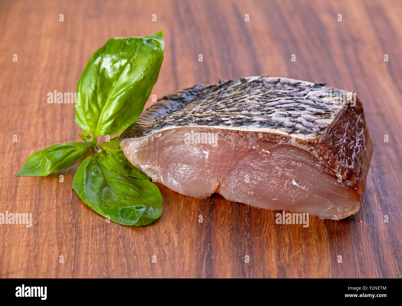 Carp fillet slice closeup on wood table Stock Photo - Alamy