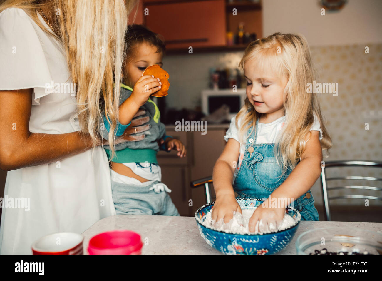 Kids is playing with flour Stock Photo - Alamy