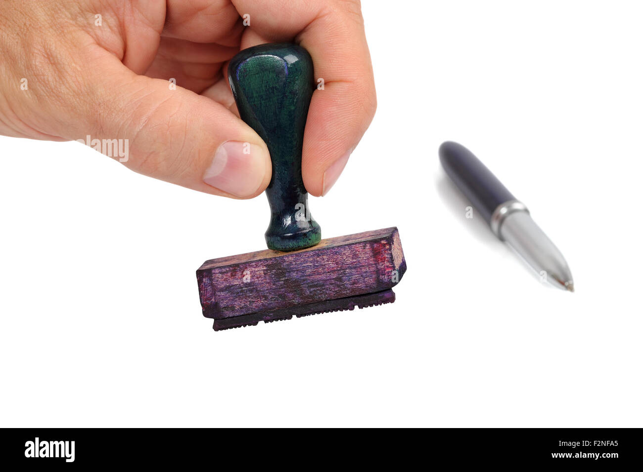 Hand holds rubber stamp Stock Photo - Alamy