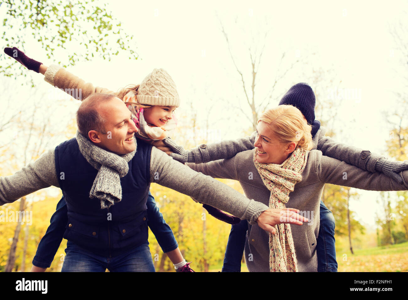 happy family having fun in autumn park Stock Photo - Alamy