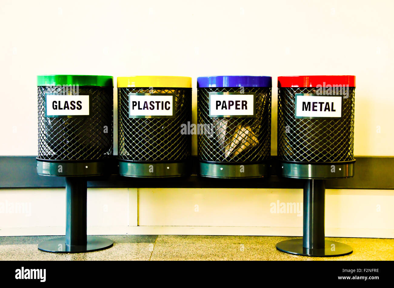 Four recycling bins, the main materials to be recycled, glass, plastic ...