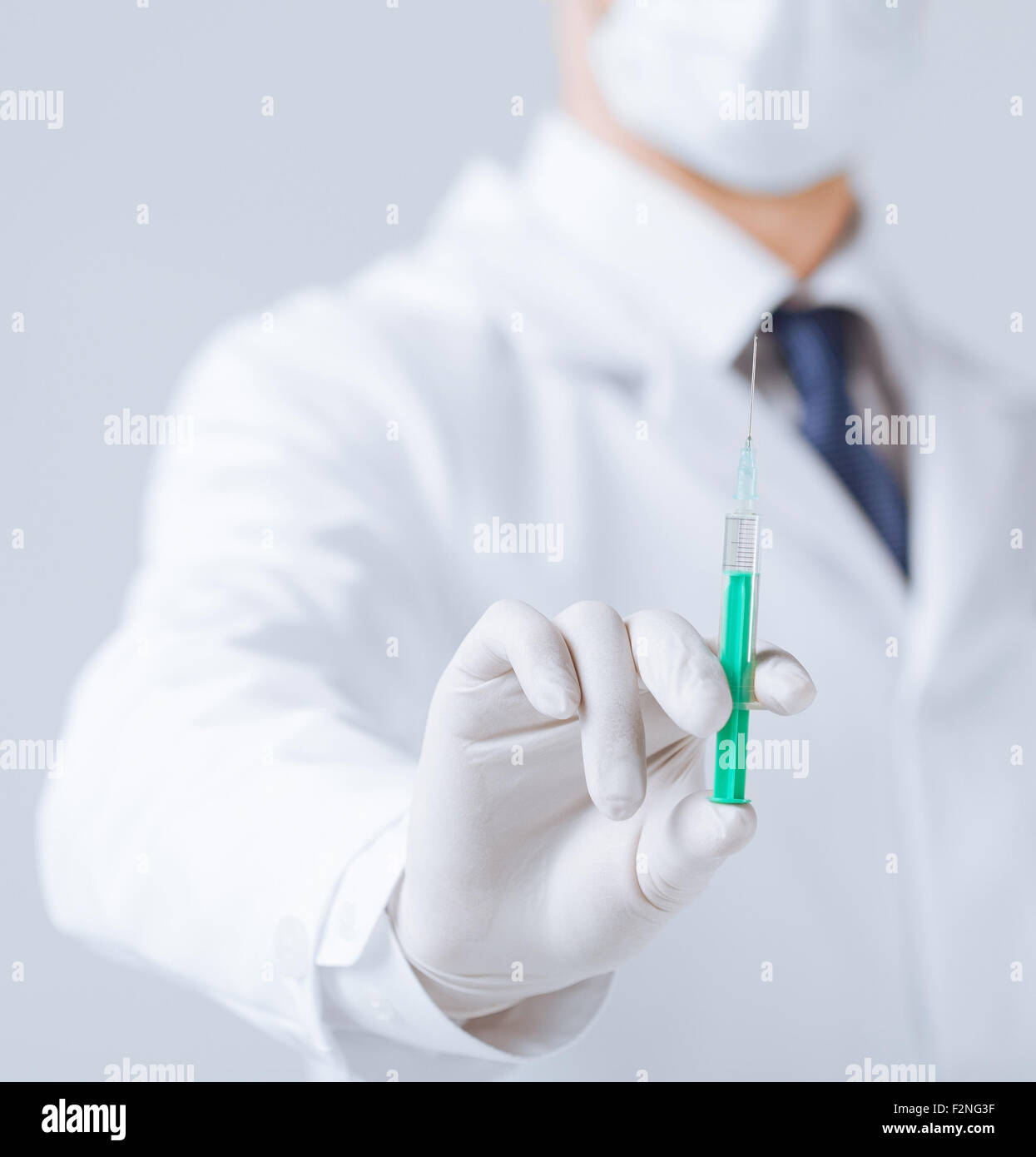 male doctor holding syringe with injection Stock Photo - Alamy