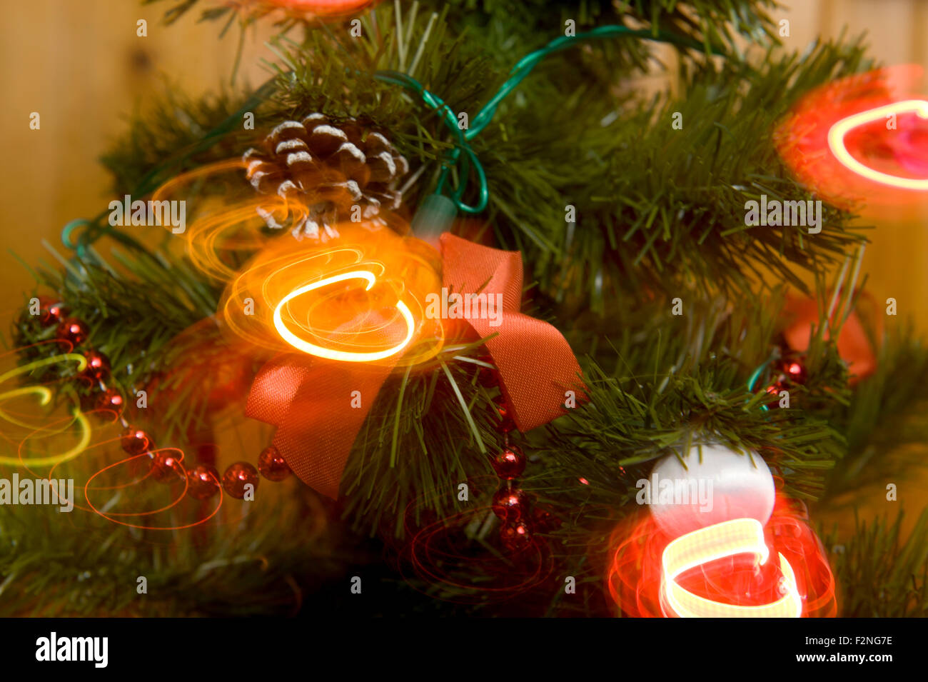 A zoomed image of traditional lights on a pine christmas tree Stock ...