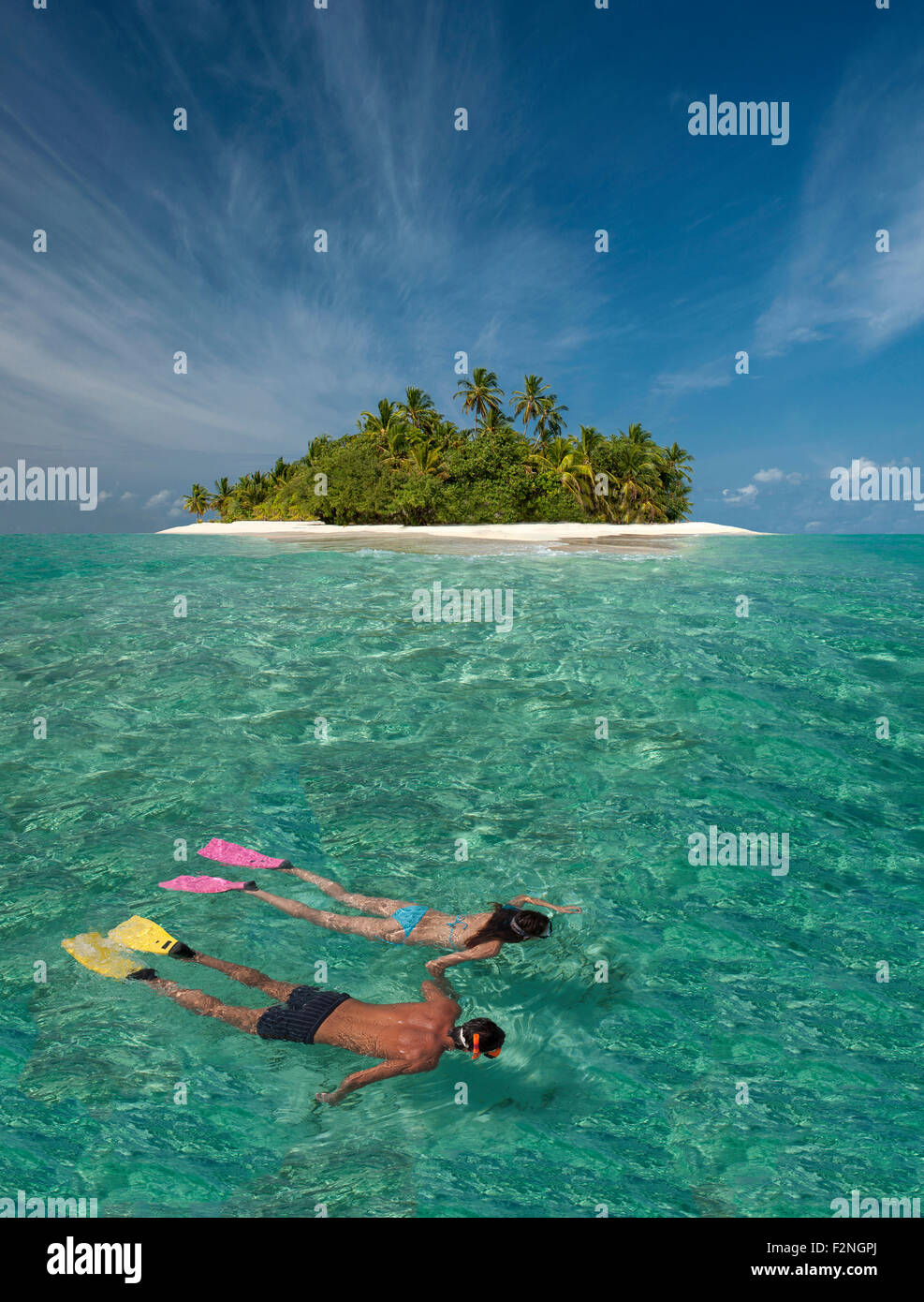 Caucasian couple snorkeling off tropical island Stock Photo - Alamy