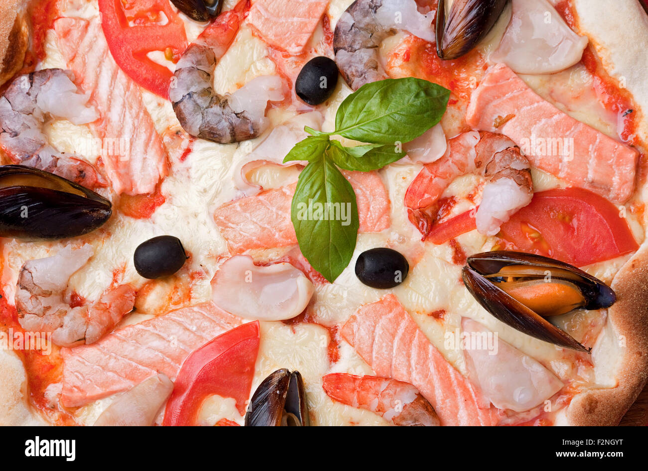Pizza with seafood mussel and salmon fish Stock Photo - Alamy