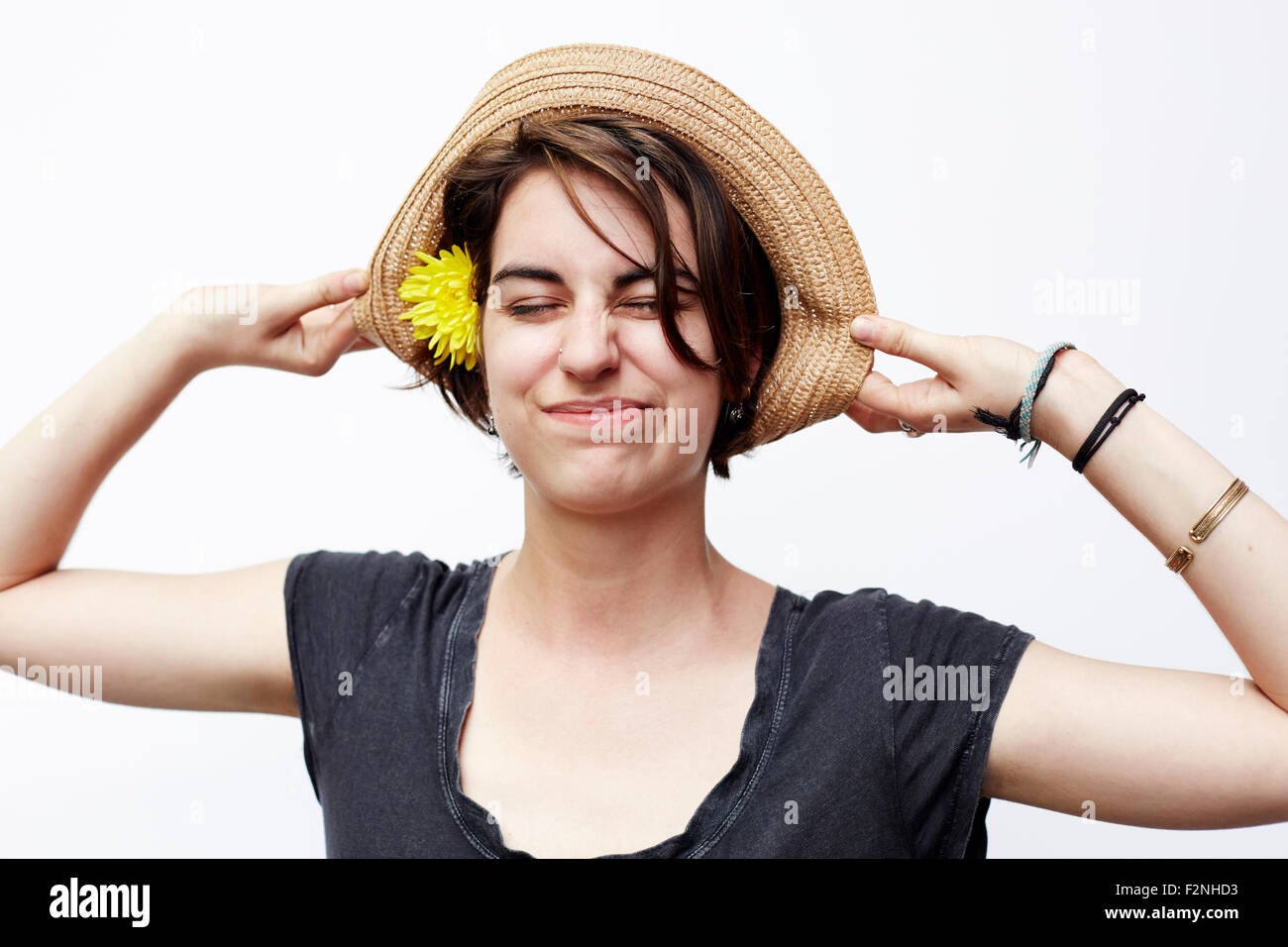 Close up of woman wearing straw hat Stock Photo - Alamy
