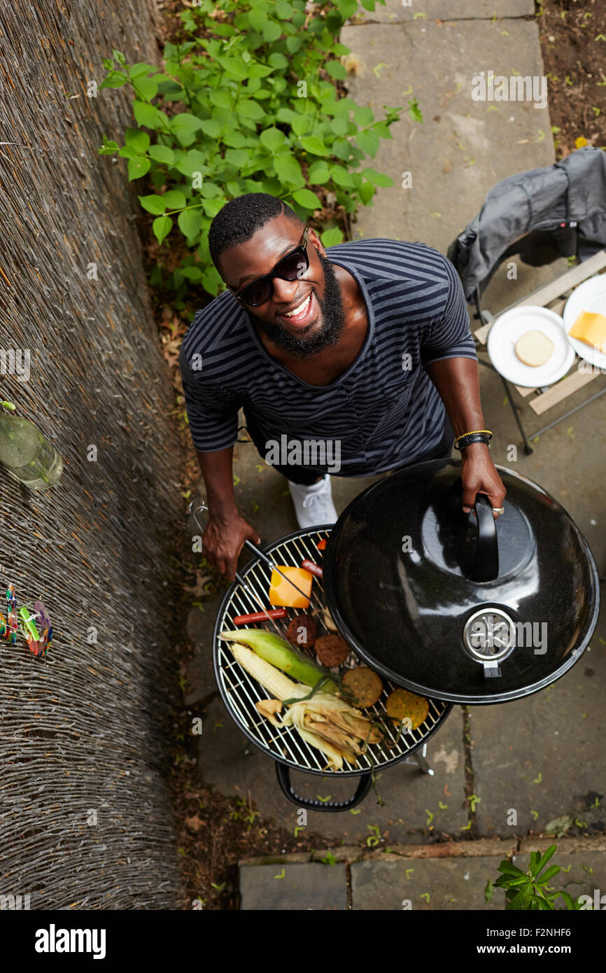 High angle view of African American man grilling at barbecue Stock ...