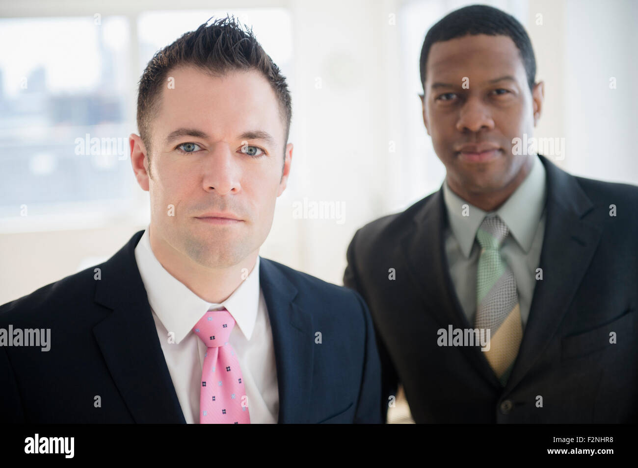 Close up of serious businessmen in office Stock Photo - Alamy