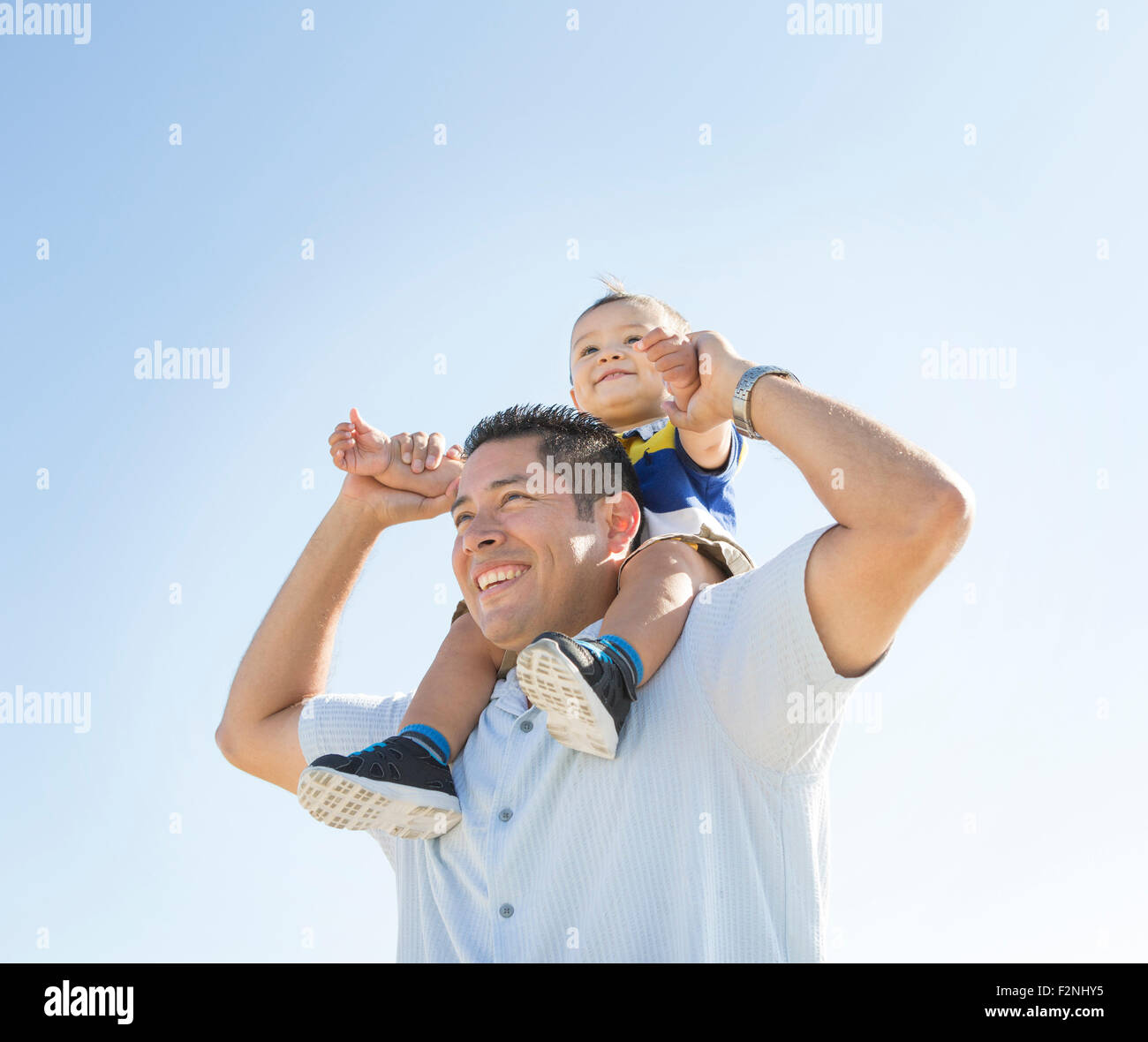 Father carrying baby on shoulder hi-res stock photography and images ...