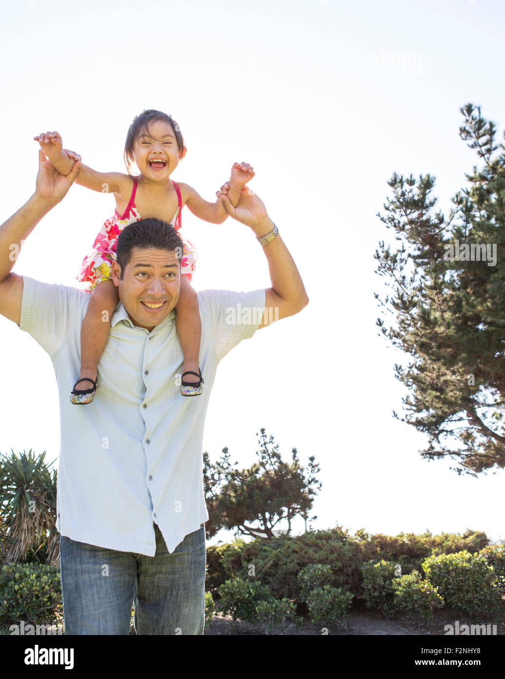 Father carrying daughter on shoulders hi-res stock photography and images - Alamy