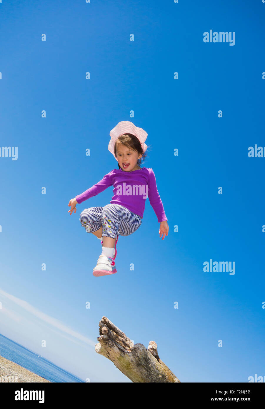 Positive girl jumping hi-res stock photography and images - Alamy