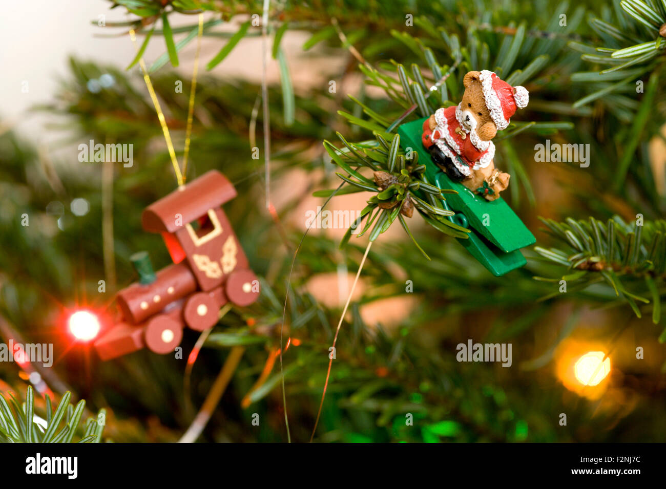 bright red steam engine and bear shaped wooden christmas tree ...