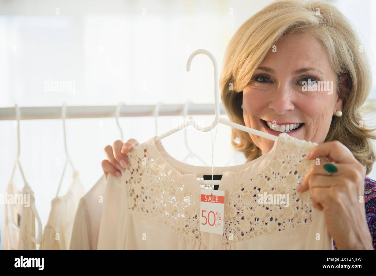 Woman in clothes store hi-res stock photography and images - Alamy