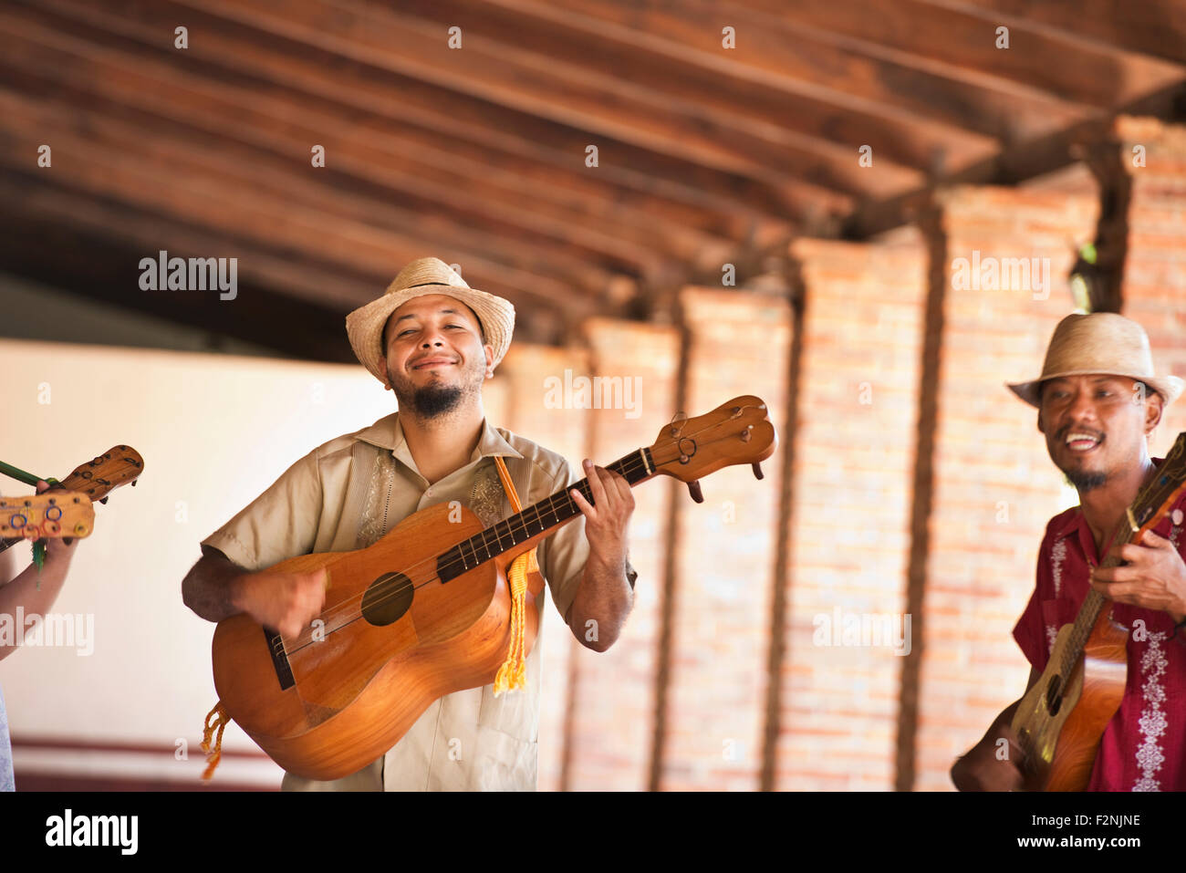 Musicians performing in courtyard Stock Photo - Alamy