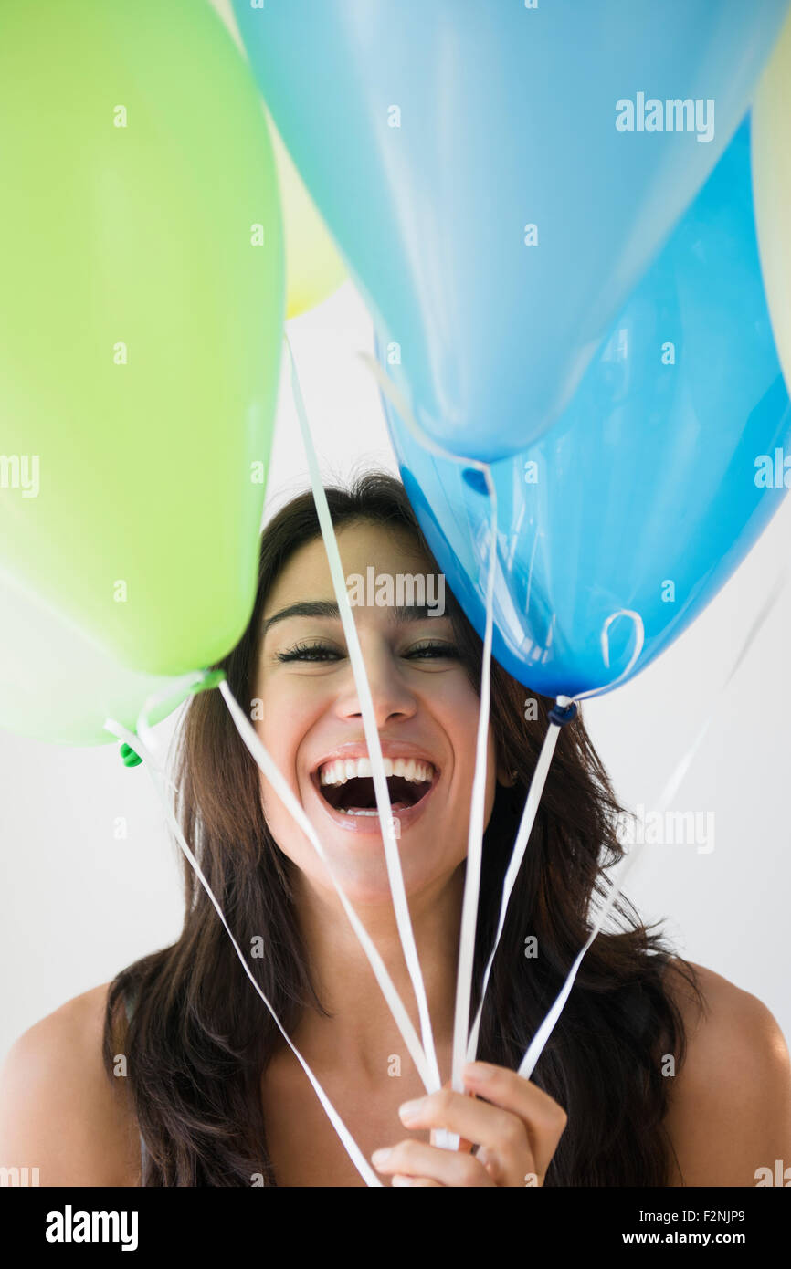 Holding string of balloon hi-res stock photography and images - Alamy