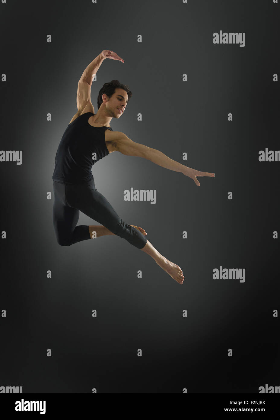 Hispanic ballet dancer leaping in mid-air Stock Photo - Alamy