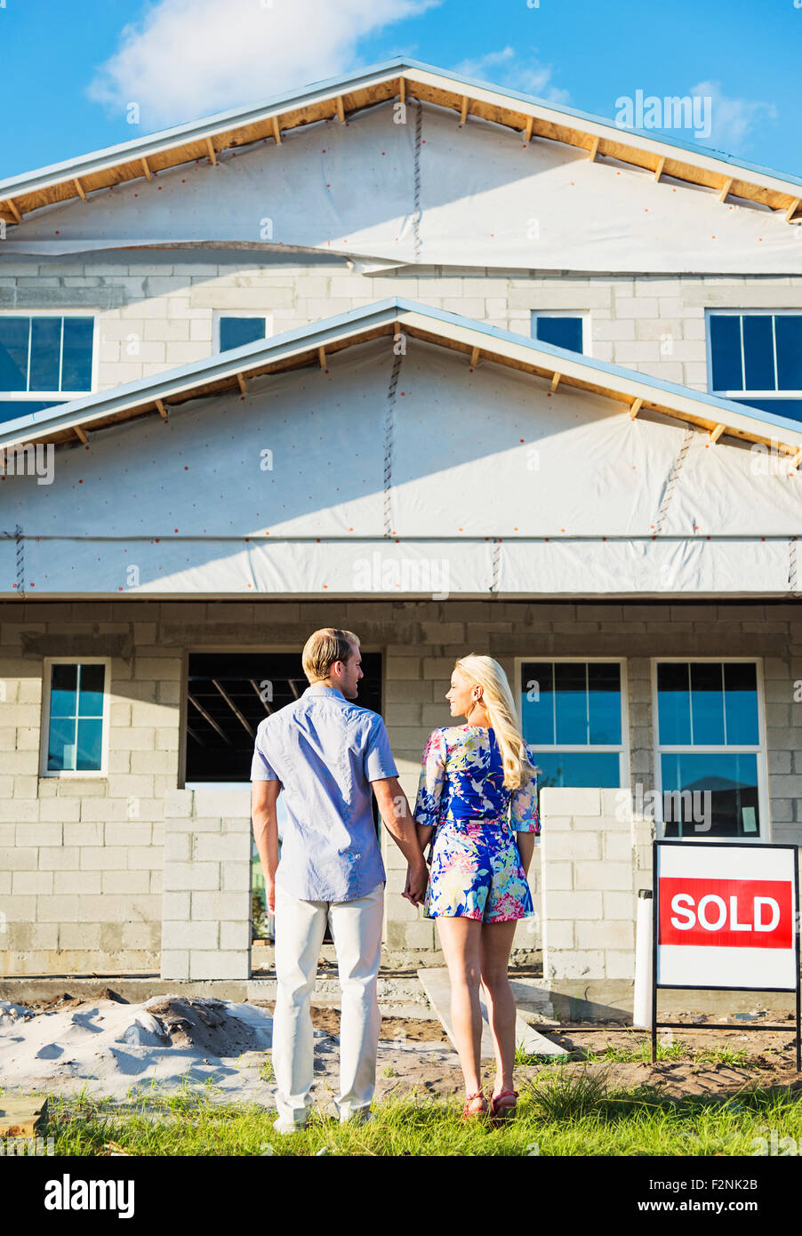 Caucasian couple admiring new home Stock Photo - Alamy Caucasian couple admiring new home Stock Photo - Alamy