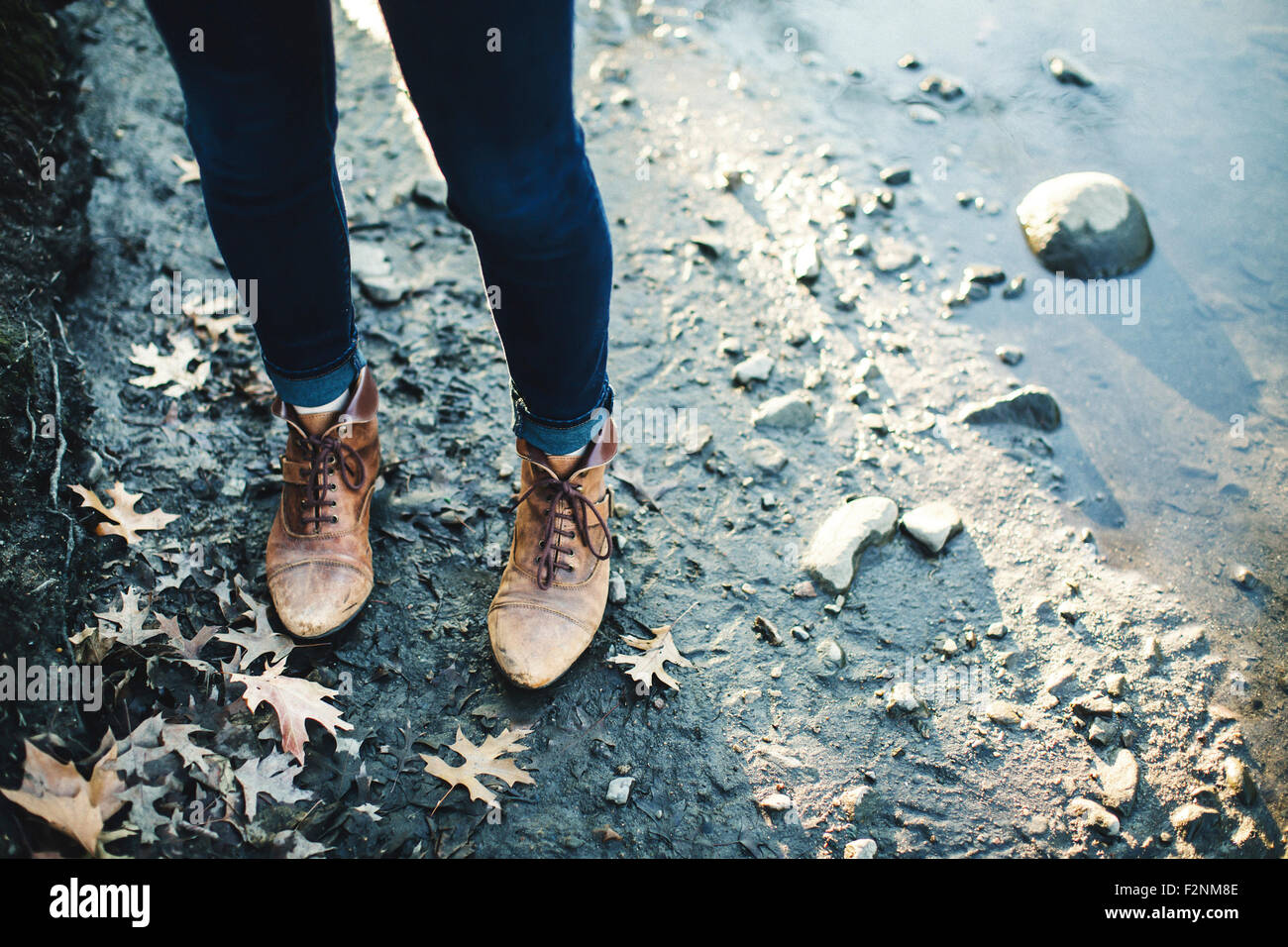 Close up of Caucasian woman standing near puddle Stock Photo - Alamy