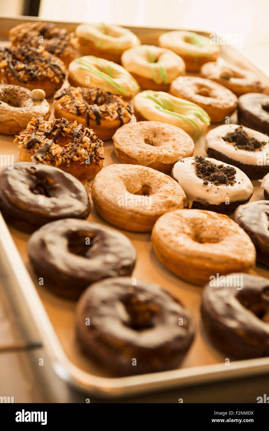 Close up of donuts for sale in bakery Stock Photo - Alamy
