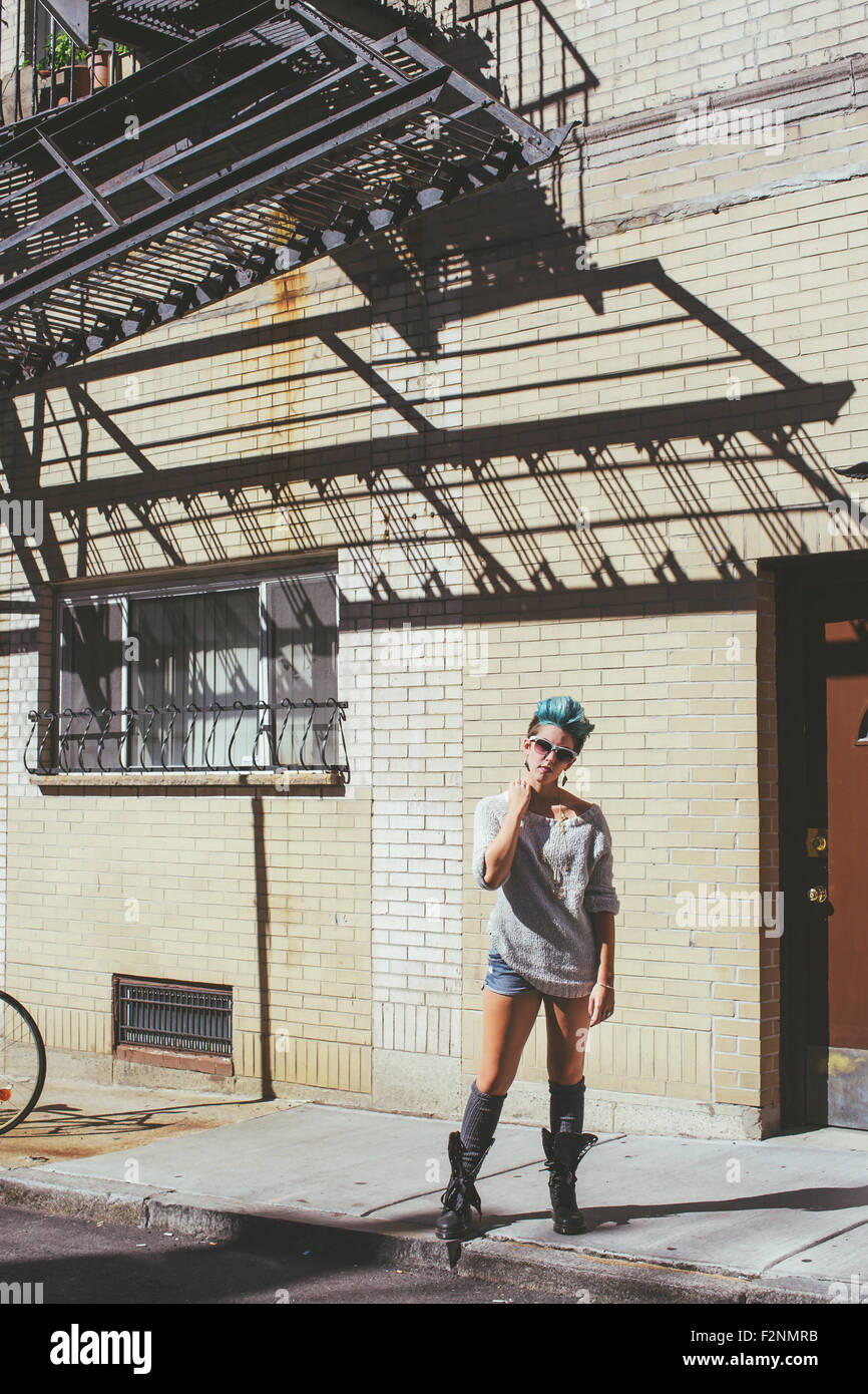Woman standing on pavement hi-res stock photography and images - Alamy