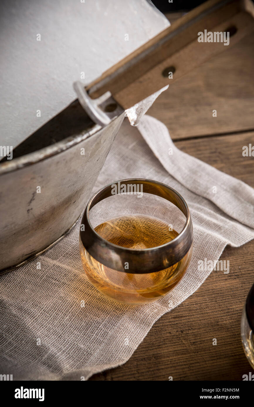 Cocktail glasses and ice block on table Stock Photo - Alamy