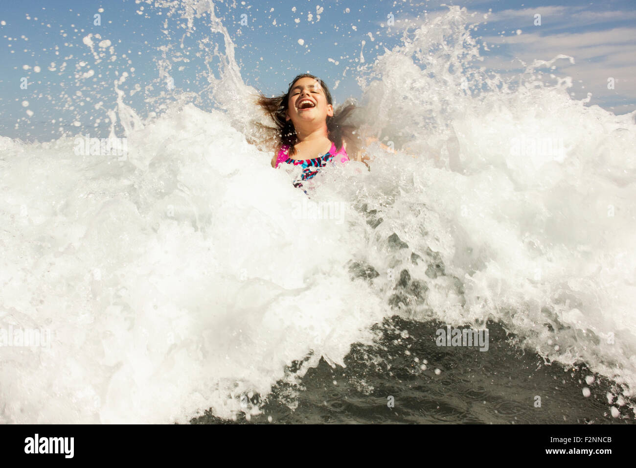 Happy girl in the ocean hi-res stock photography and images - Alamy