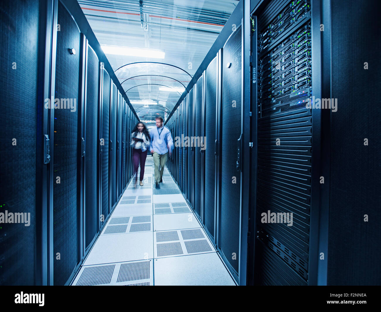 Woman walking into room full of people hi-res stock photography and ...