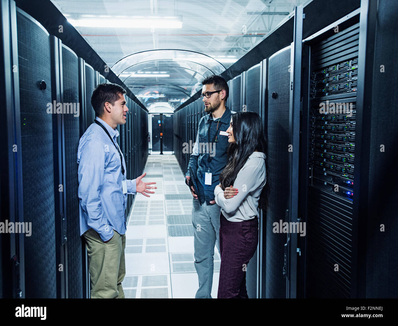 Technicians talking in server room Stock Photo - Alamy