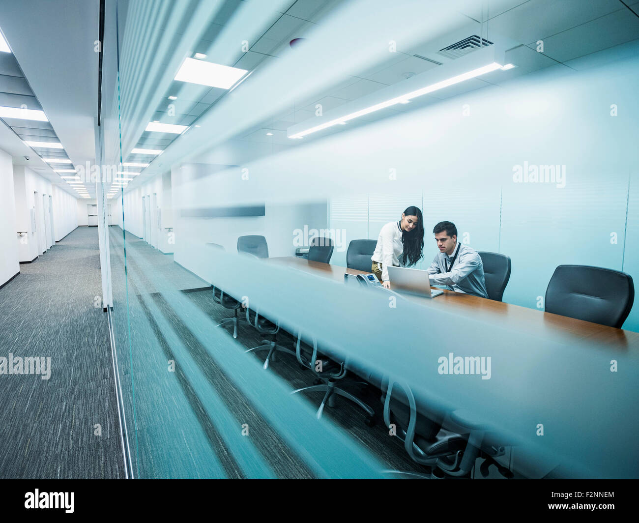 Business people using laptop in conference room Stock Photo - Alamy