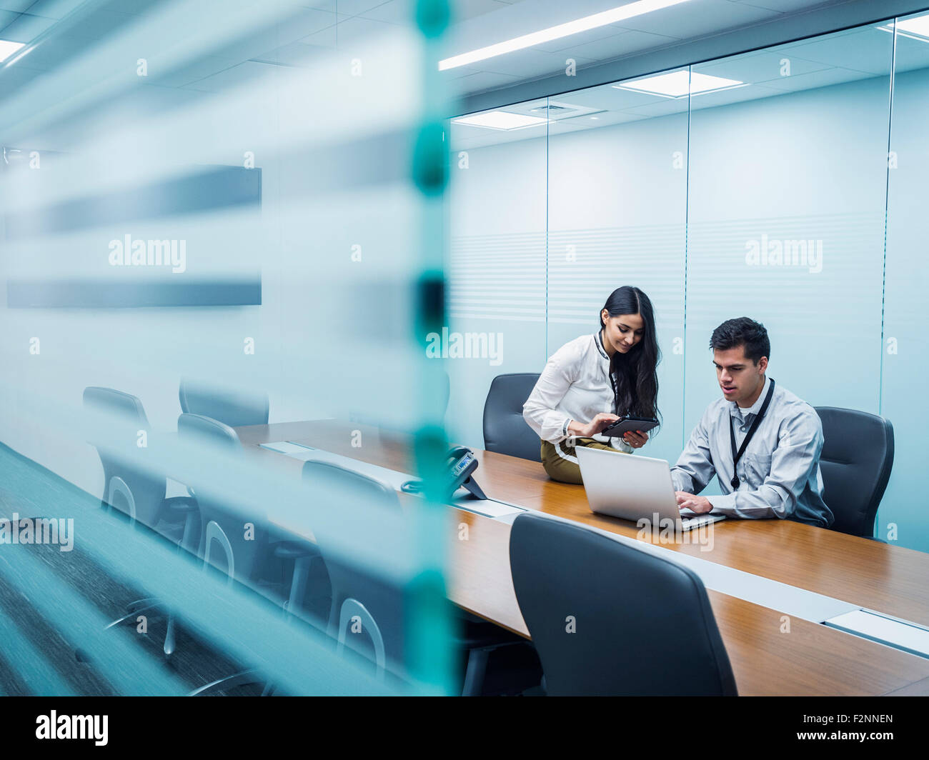 Business people using technology in conference room Stock Photo - Alamy