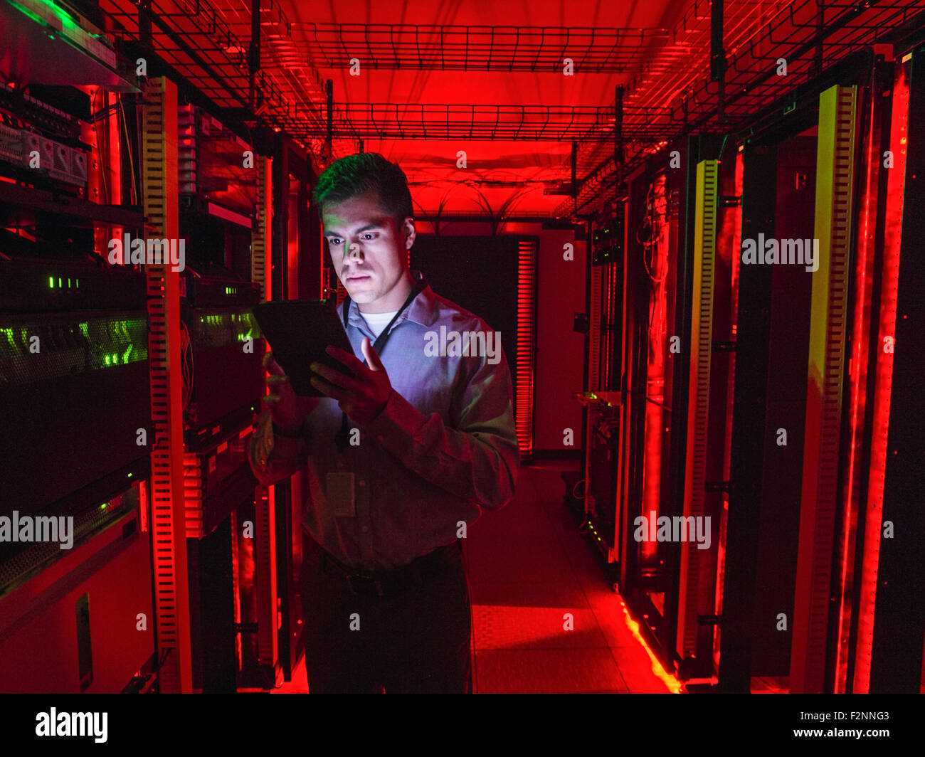 Businessman tablet server room hi-res stock photography and images - Alamy