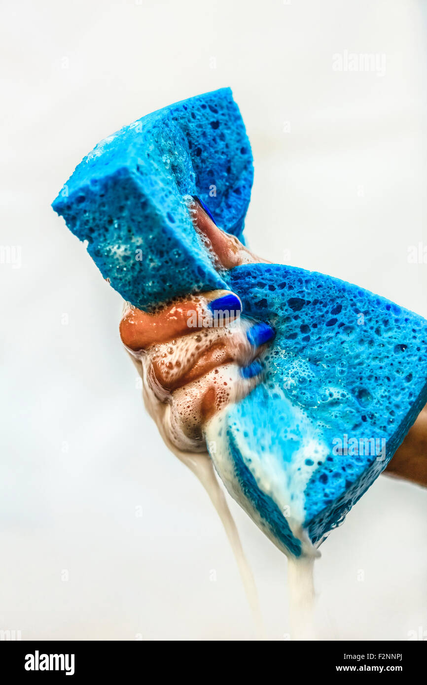 Chinese girl squeezing soapy sponge Stock Photo - Alamy