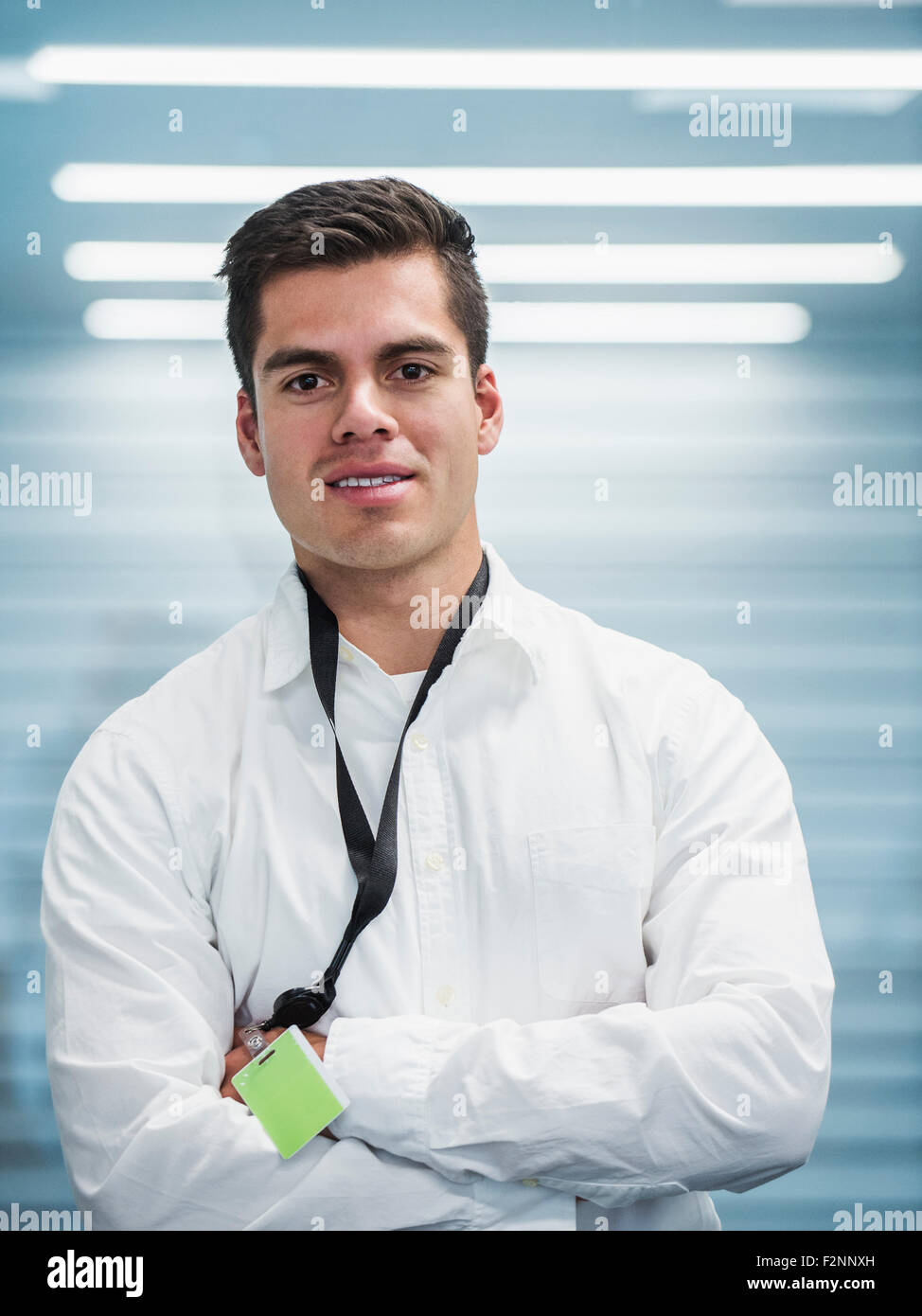 Hispanic man in office crossing hi-res stock photography and images - Alamy