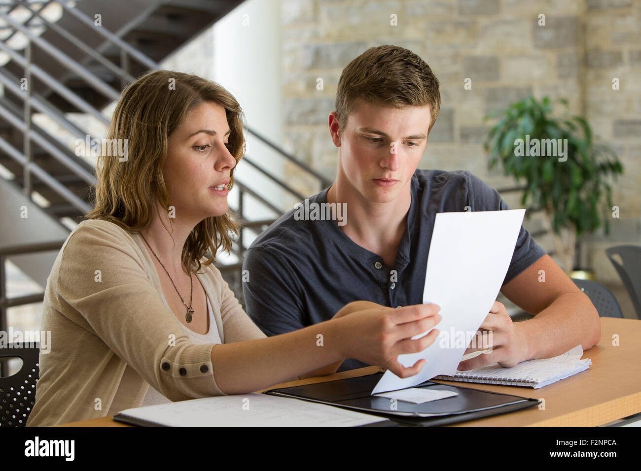 Caucasian students studying at table Stock Photo - Alamy