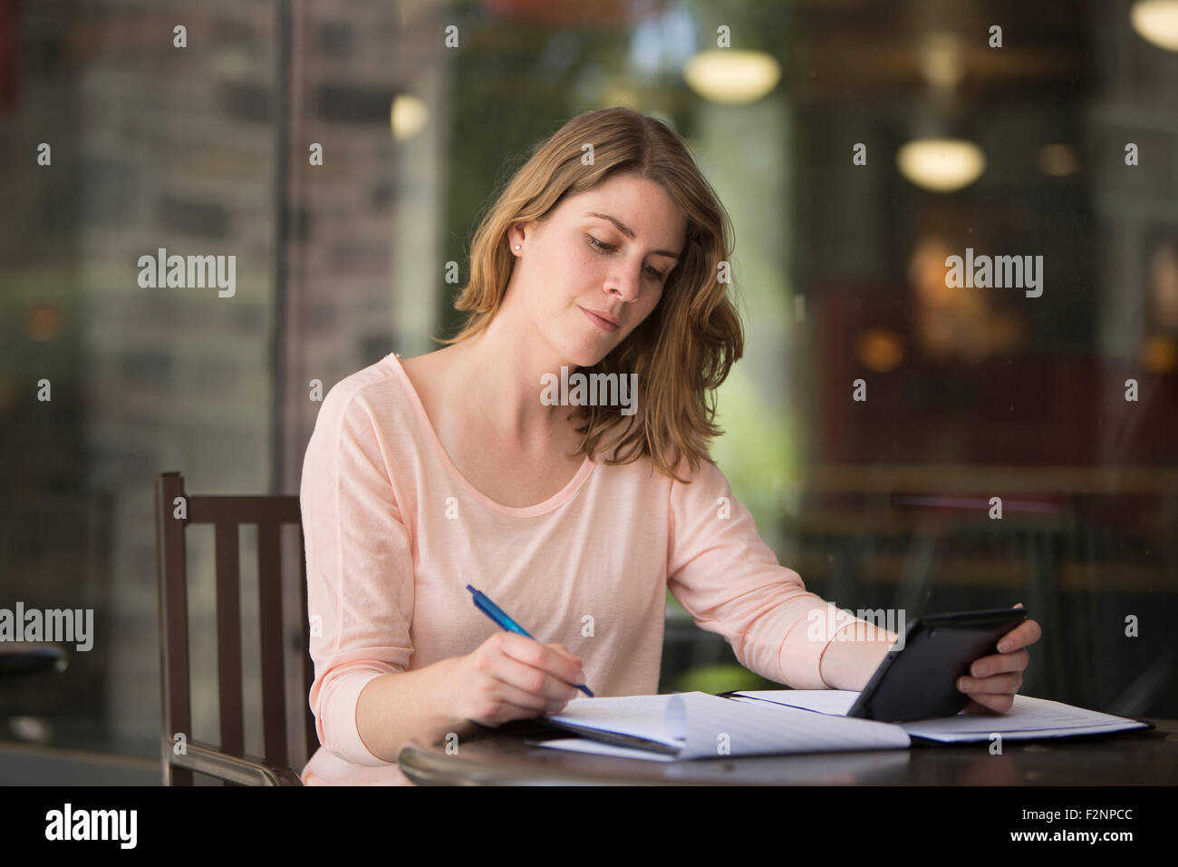 Caucasian student studying at table Stock Photo - Alamy