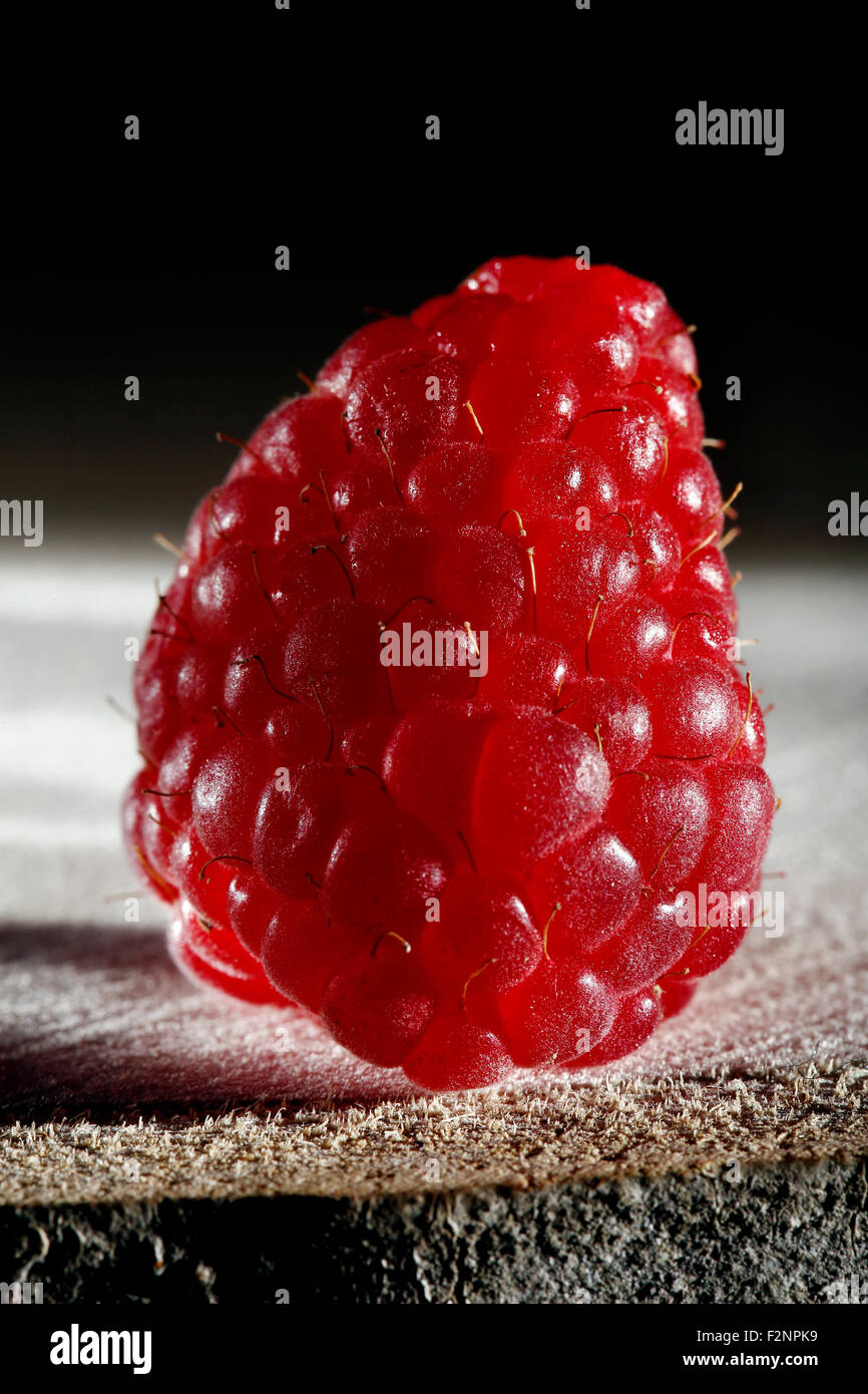 Raspberry close-up on a wood board Stock Photo - Alamy