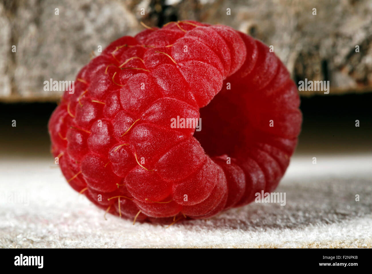 Raspberry close-up on a wood board Stock Photo - Alamy
