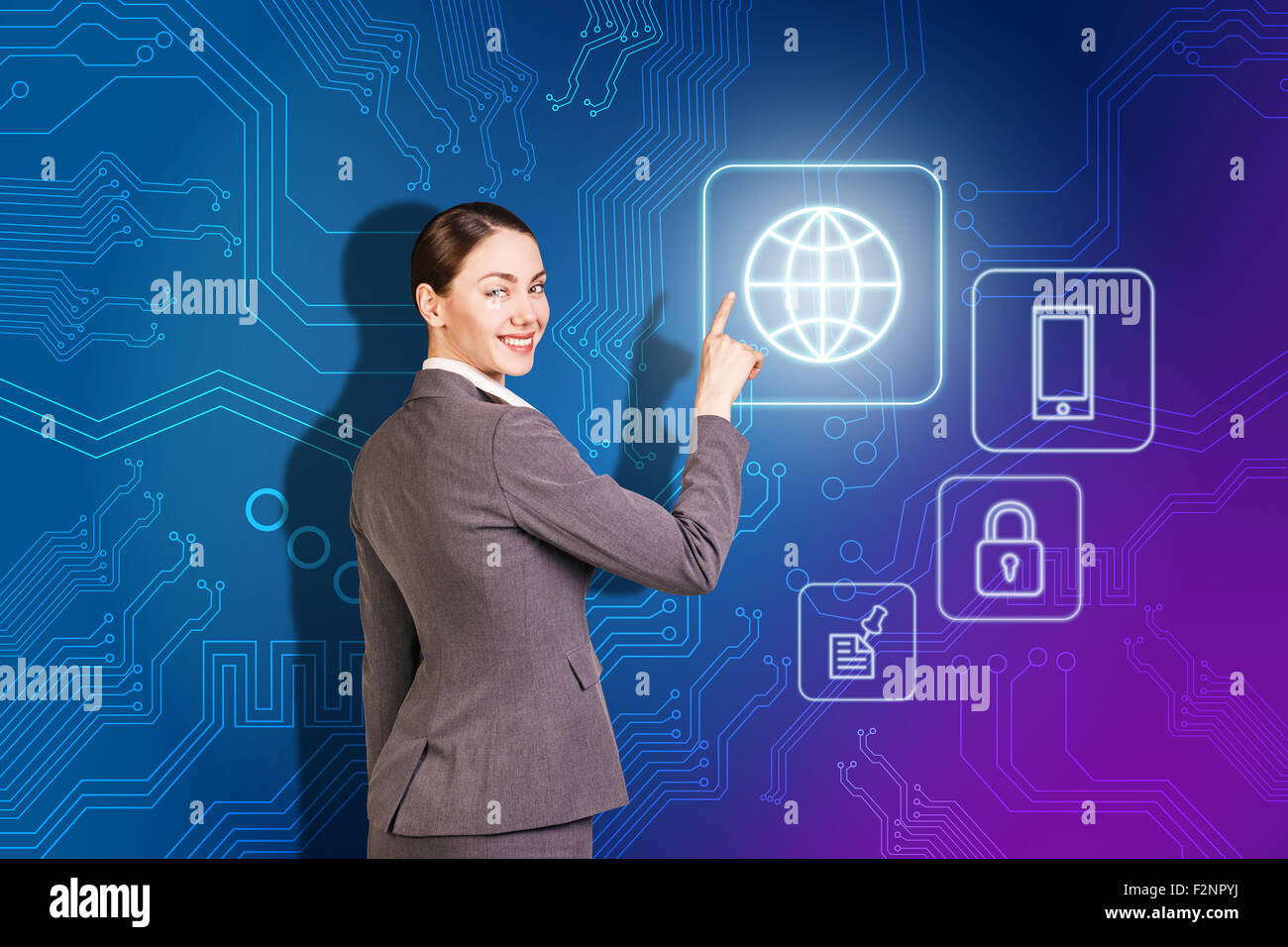 Smiling business woman point to the icon Stock Photo - Alamy