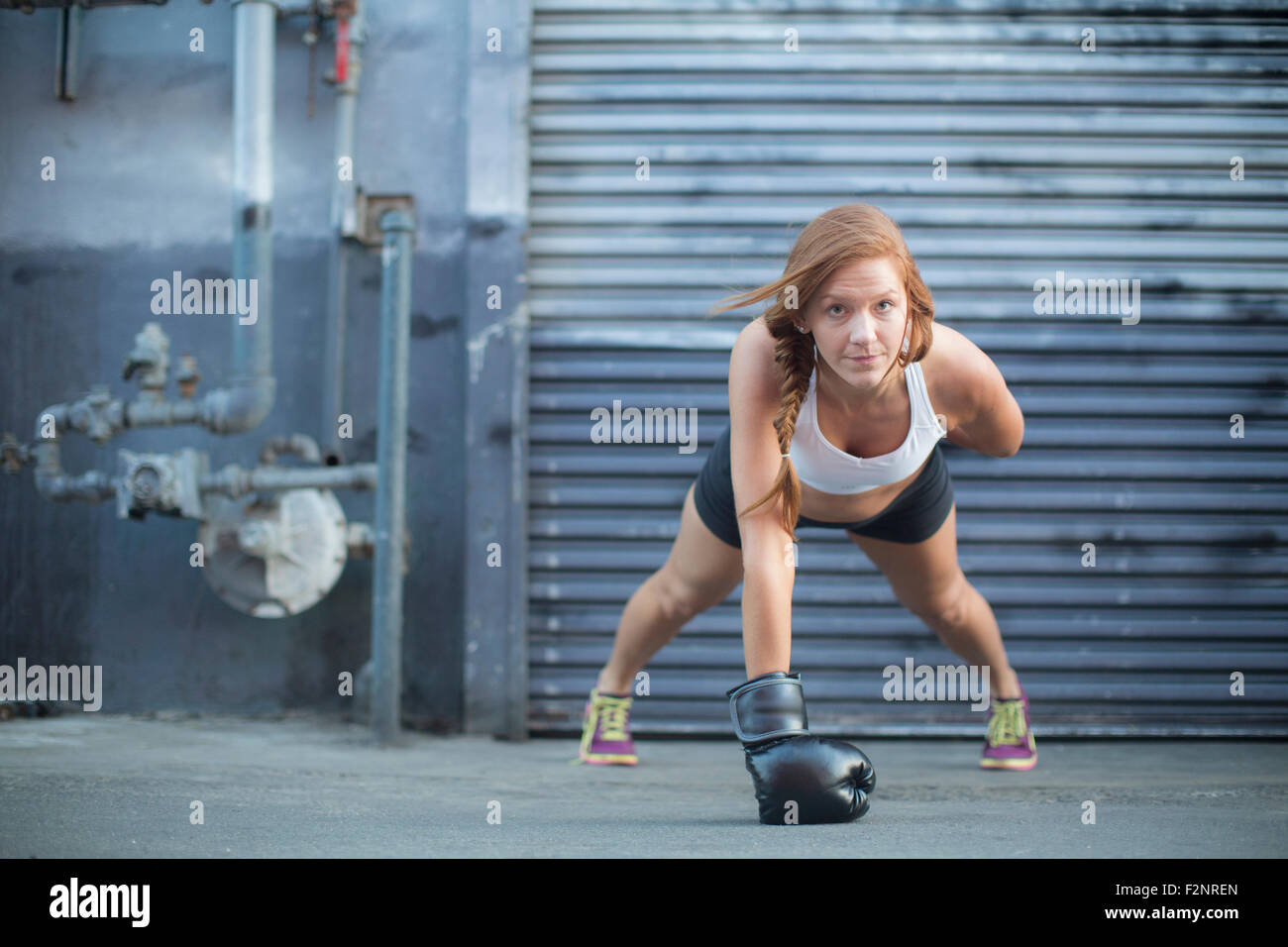 Boxer doing push-ups at warehouse Stock Photo - Alamy