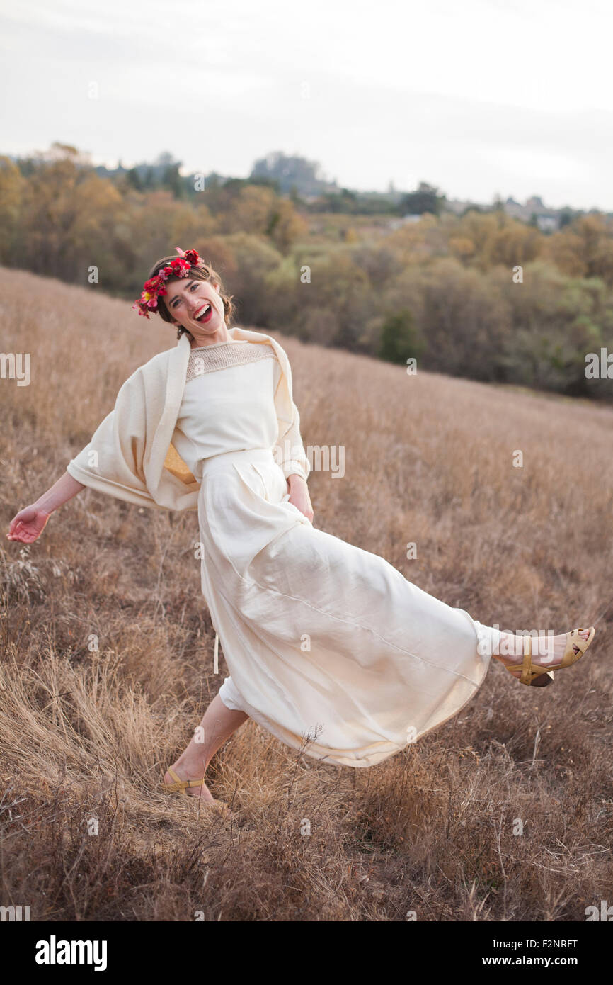 Bride walking on rural hillside Stock Photo - Alamy