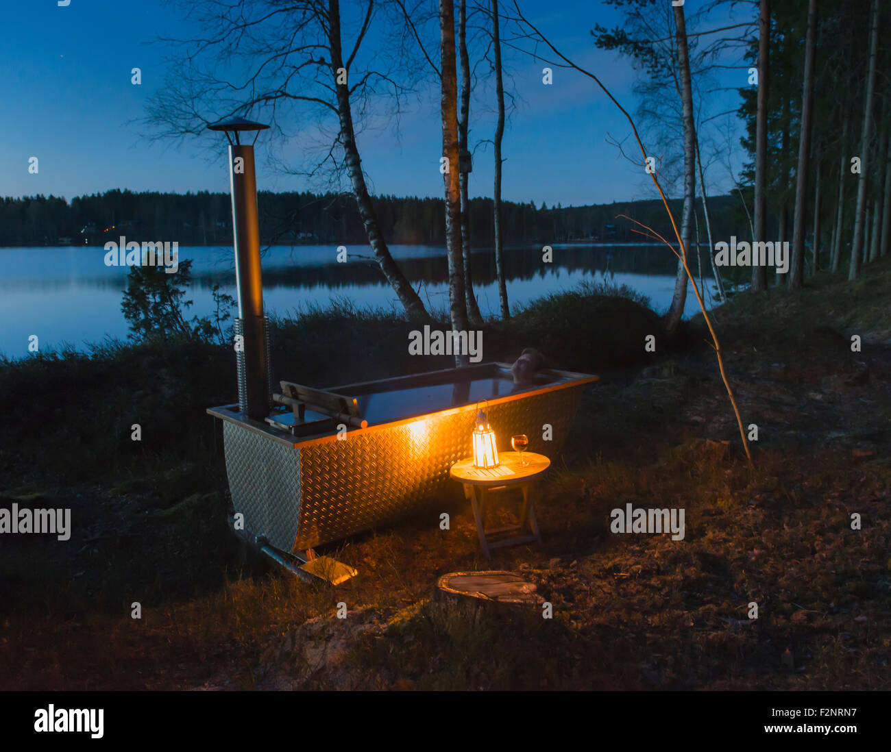 Outdoor bathtub at dusk Stock Photo - Alamy