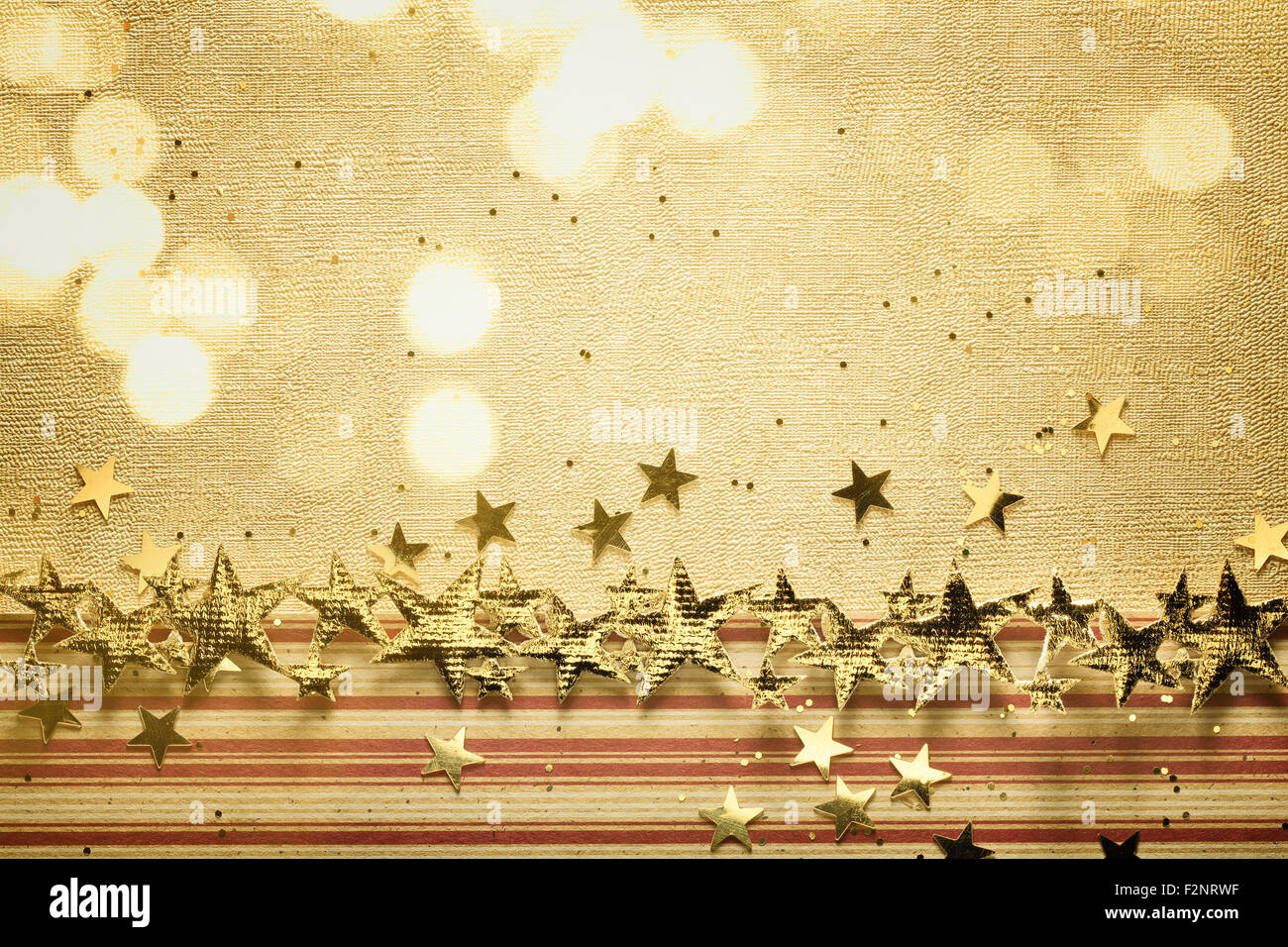 Golden star on paper textured background Stock Photo - Alamy