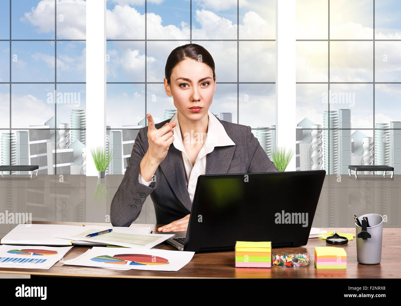 Business woman using laptop Stock Photo - Alamy