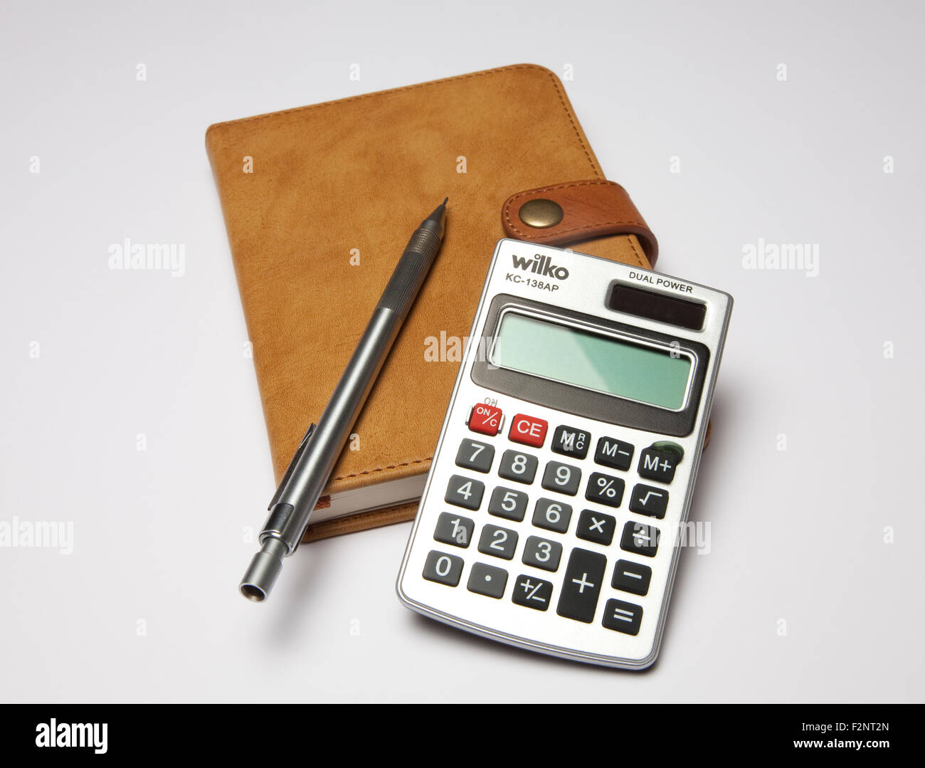 Office calculator book note pad pen hi-res stock photography and images ...