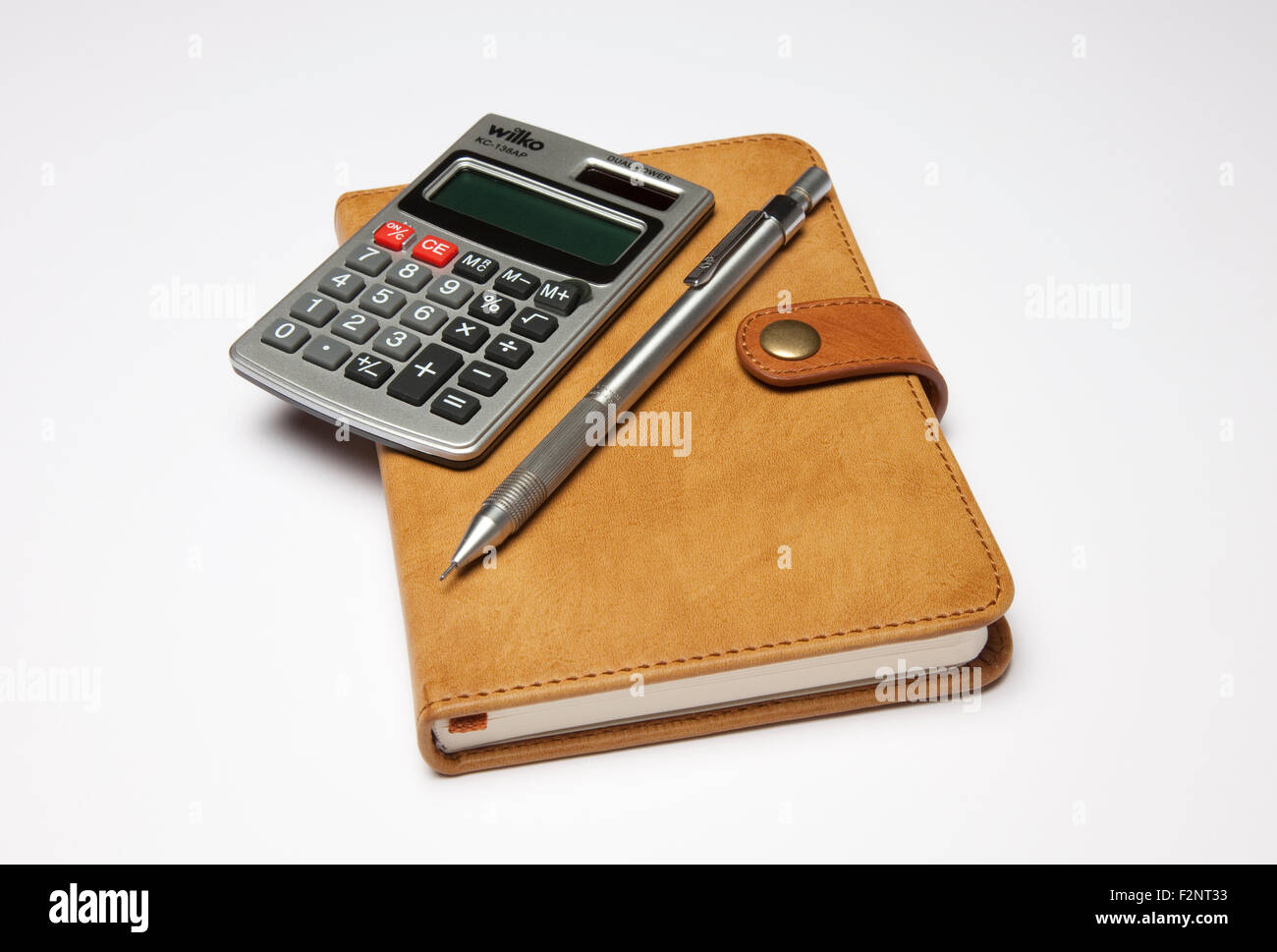 Office calculator book note pad pen hi-res stock photography and images ...
